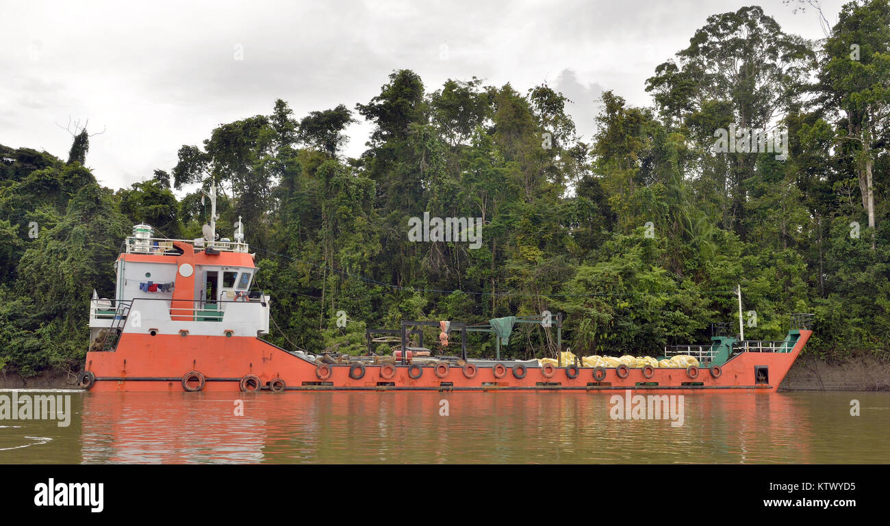 Indonesian traditional merchant ship on the river. New Guinea Island ...