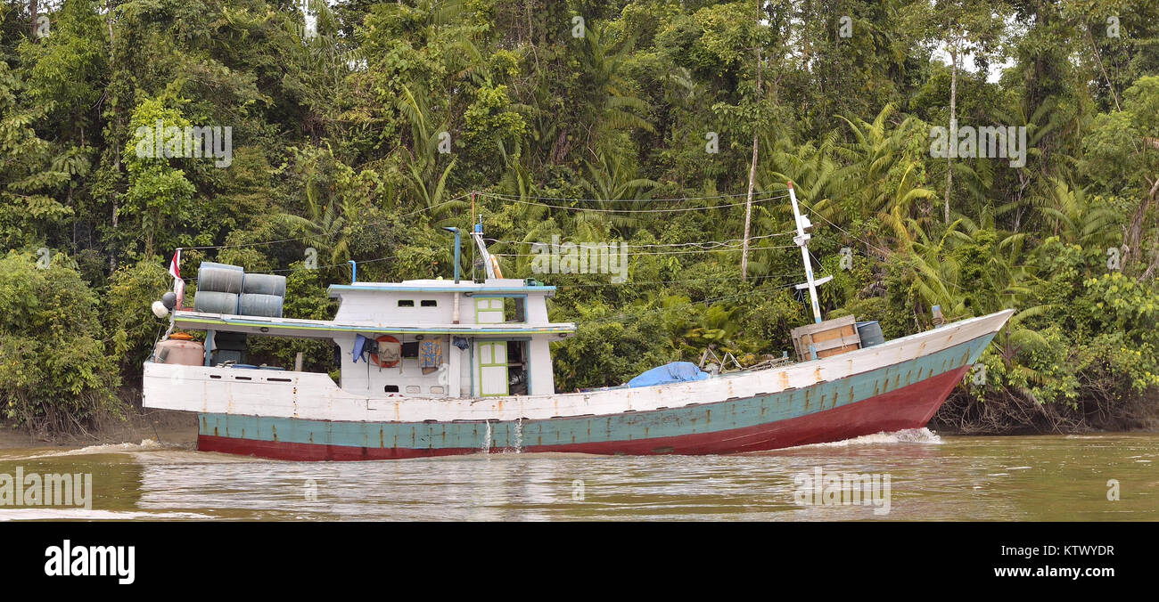 Indonesian traditional merchant ship on the river. New Guinea Island ...