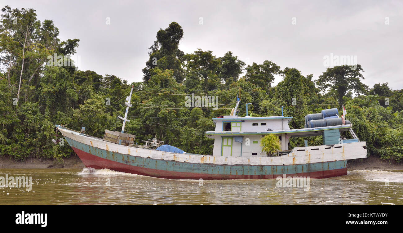 Indonesian traditional merchant ship on the river. New Guinea Island ...