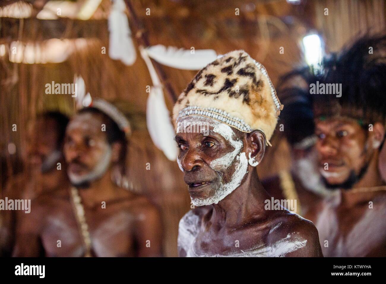 Portrait of a man from the tribe of Asmat people in the ritual face ...