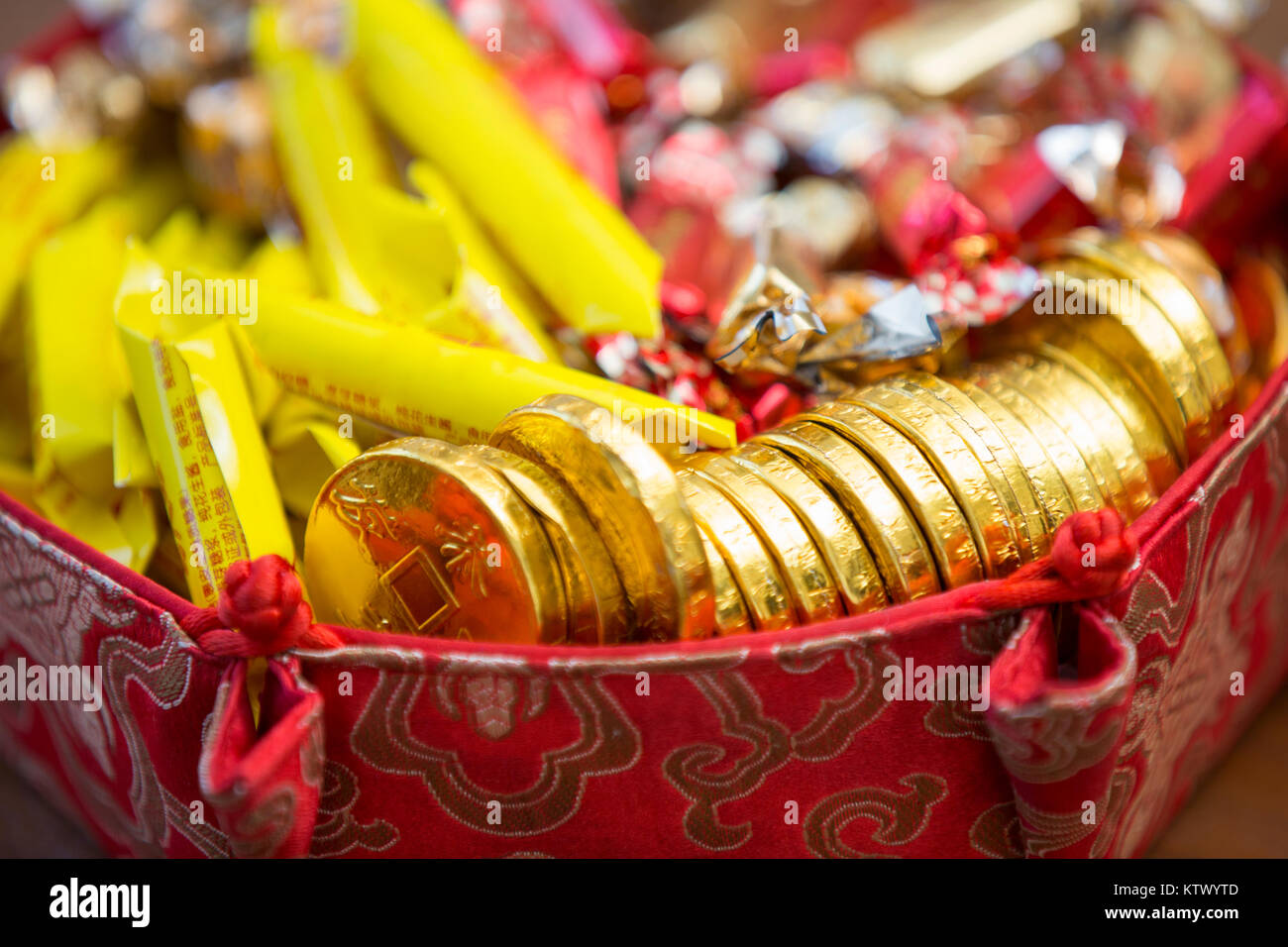 Chocolate coins and candies Stock Photo - Alamy