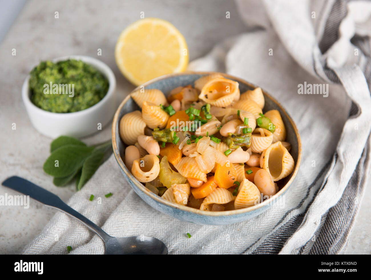 Pasta Shells Served with White Beans and Pesto Stock Photo - Alamy