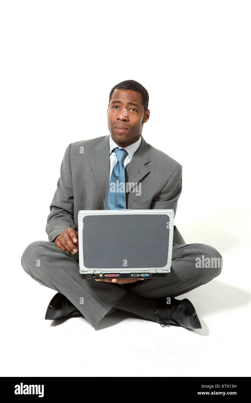 portrait of black businessman with laptop over white background Stock ...
