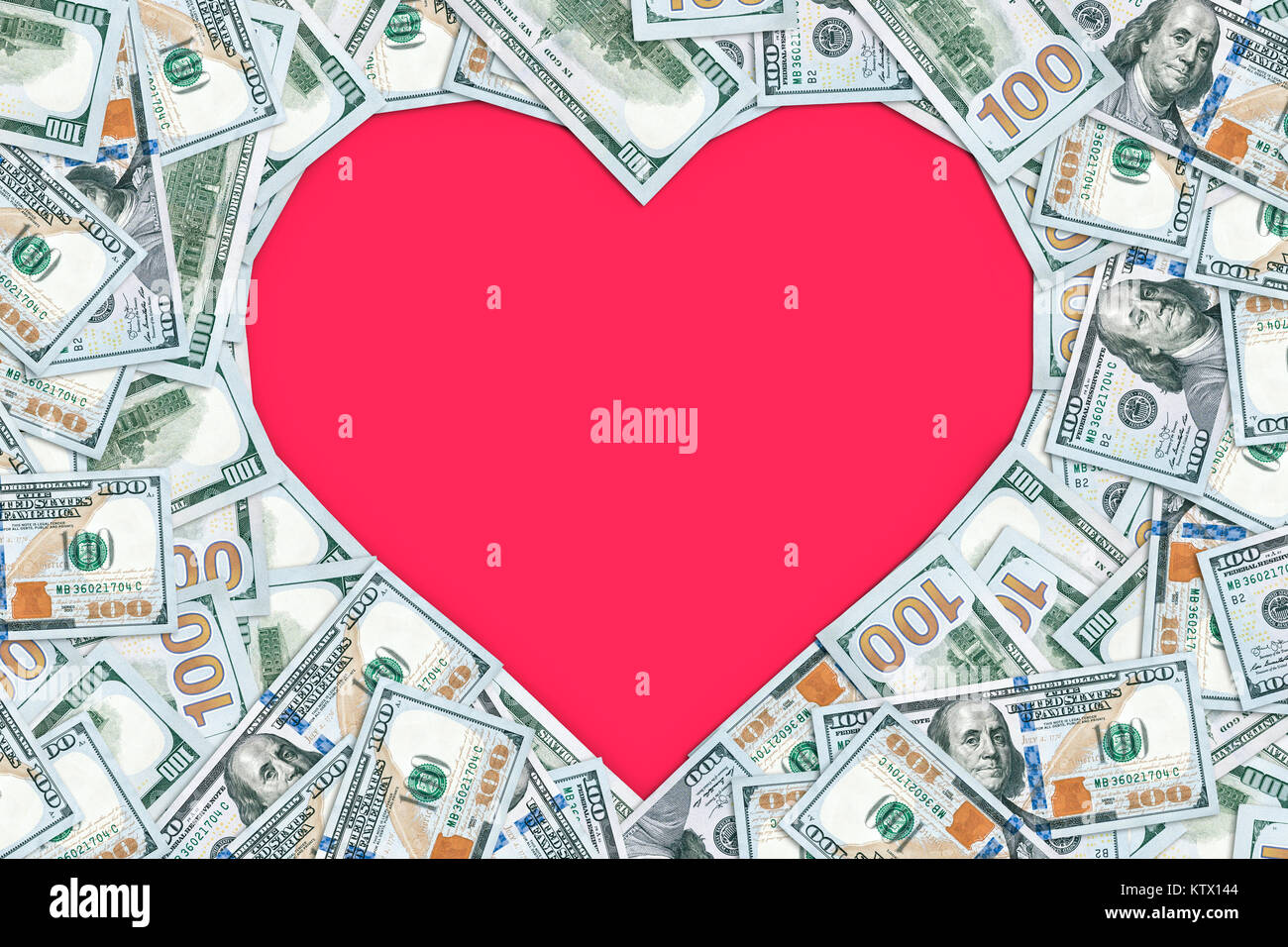 Heart shaped empty frame made with many 100 dollar banknotes isolated ...