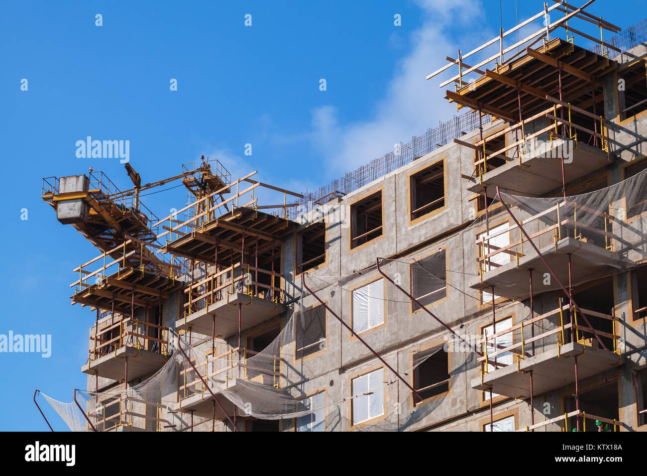 Modern concrete house carcass with balconies, building is under ...