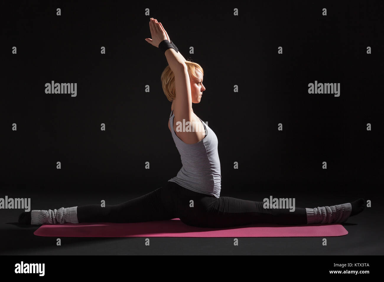 Young woman practicing yoga, Hanumanasana / Monkey Pose Stock Photo - Alamy