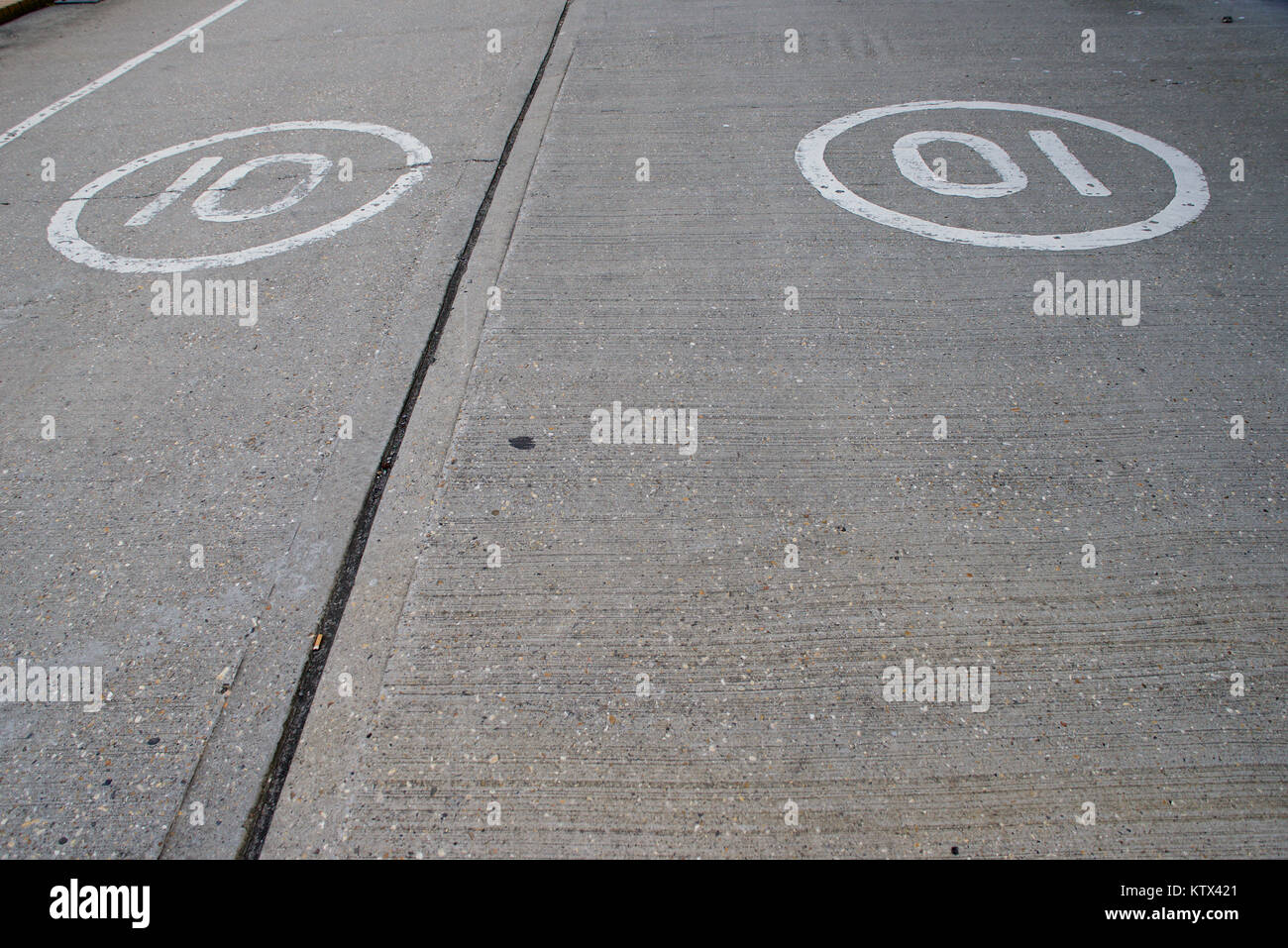 Number Ten in a circle on concrete Stock Photo - Alamy
