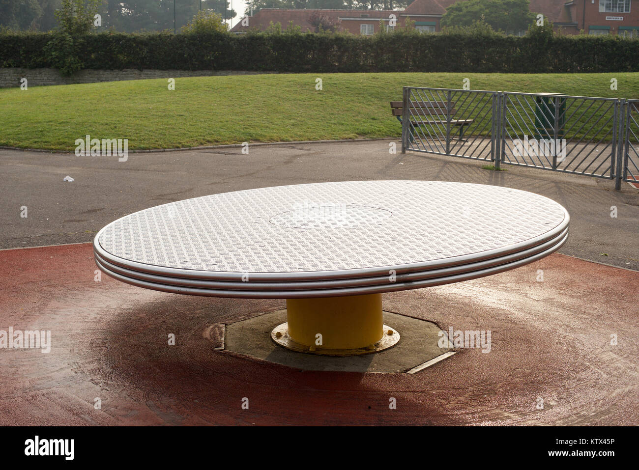 Circular ride in a wet children's park Stock Photo - Alamy