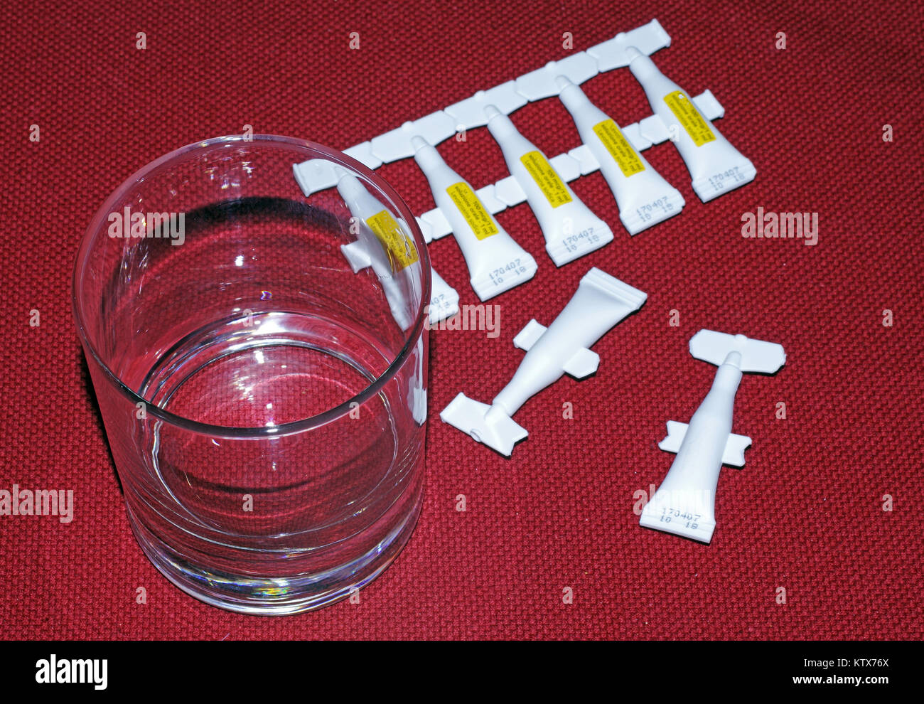 Single dose drug with glass Stock Photo - Alamy