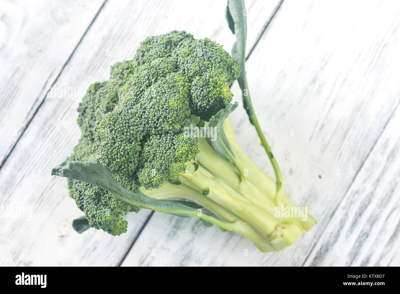 Broccoli on the wooden table Stock Photo - Alamy