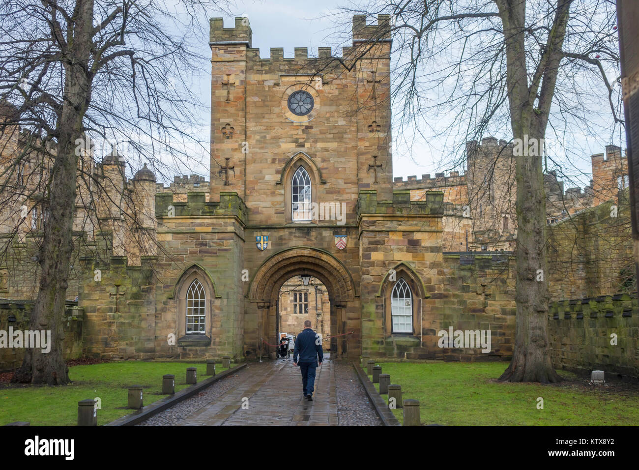 A man walking into the entrance to historic Durham Castle now part of ...