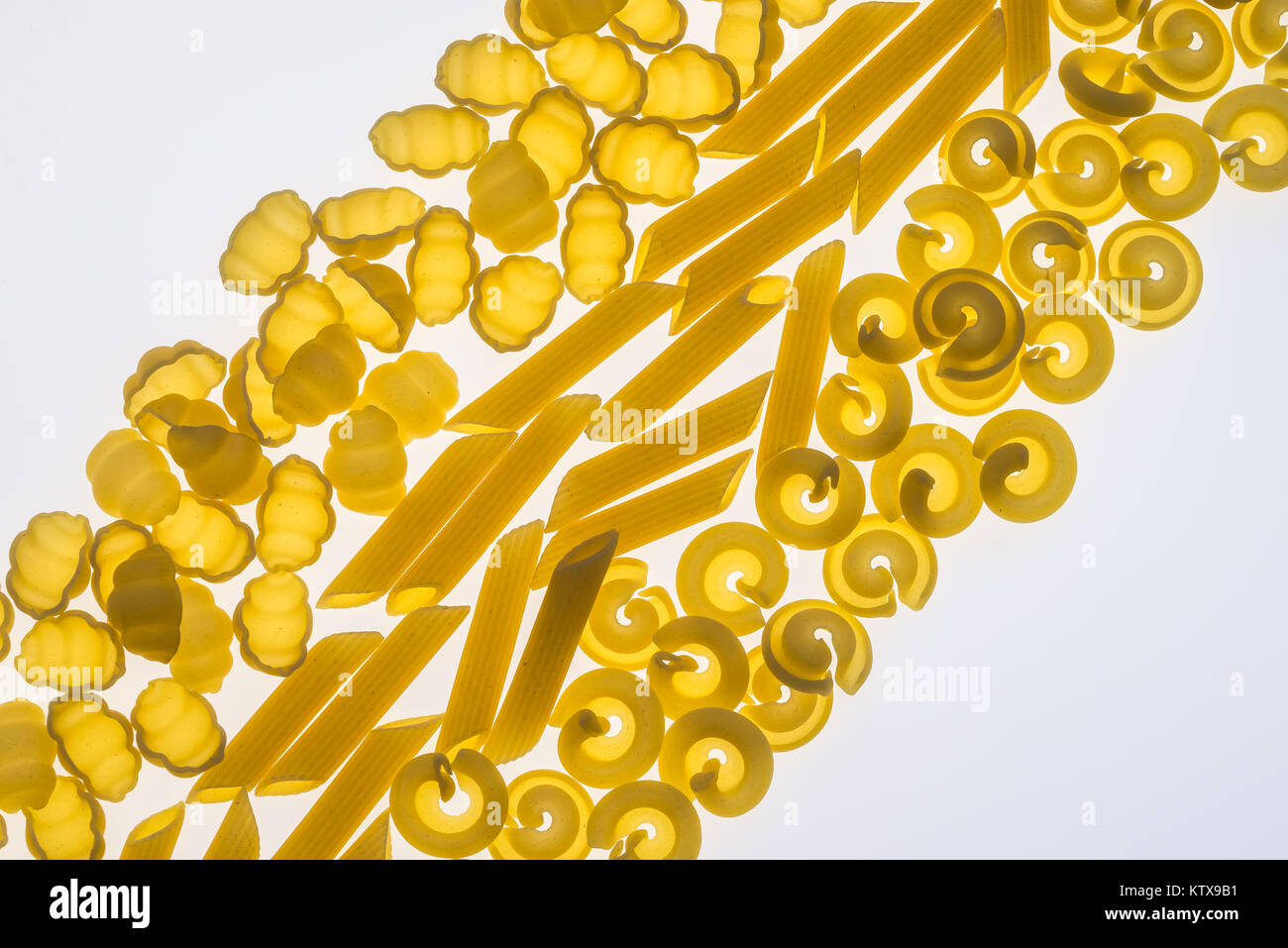 Various types of raw pasta Stock Photo - Alamy