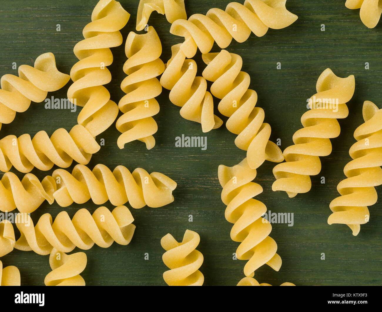 Dried Fusilli Italian Style Pasta Against a Green Background Stock ...