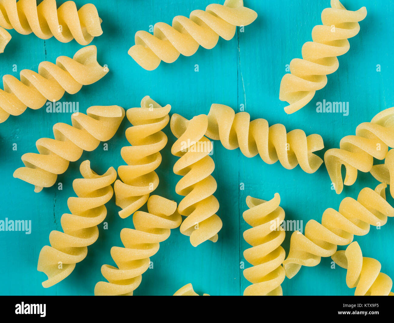 Dried Fusilli Italian Style Pasta Against a Blue Background Stock Photo ...