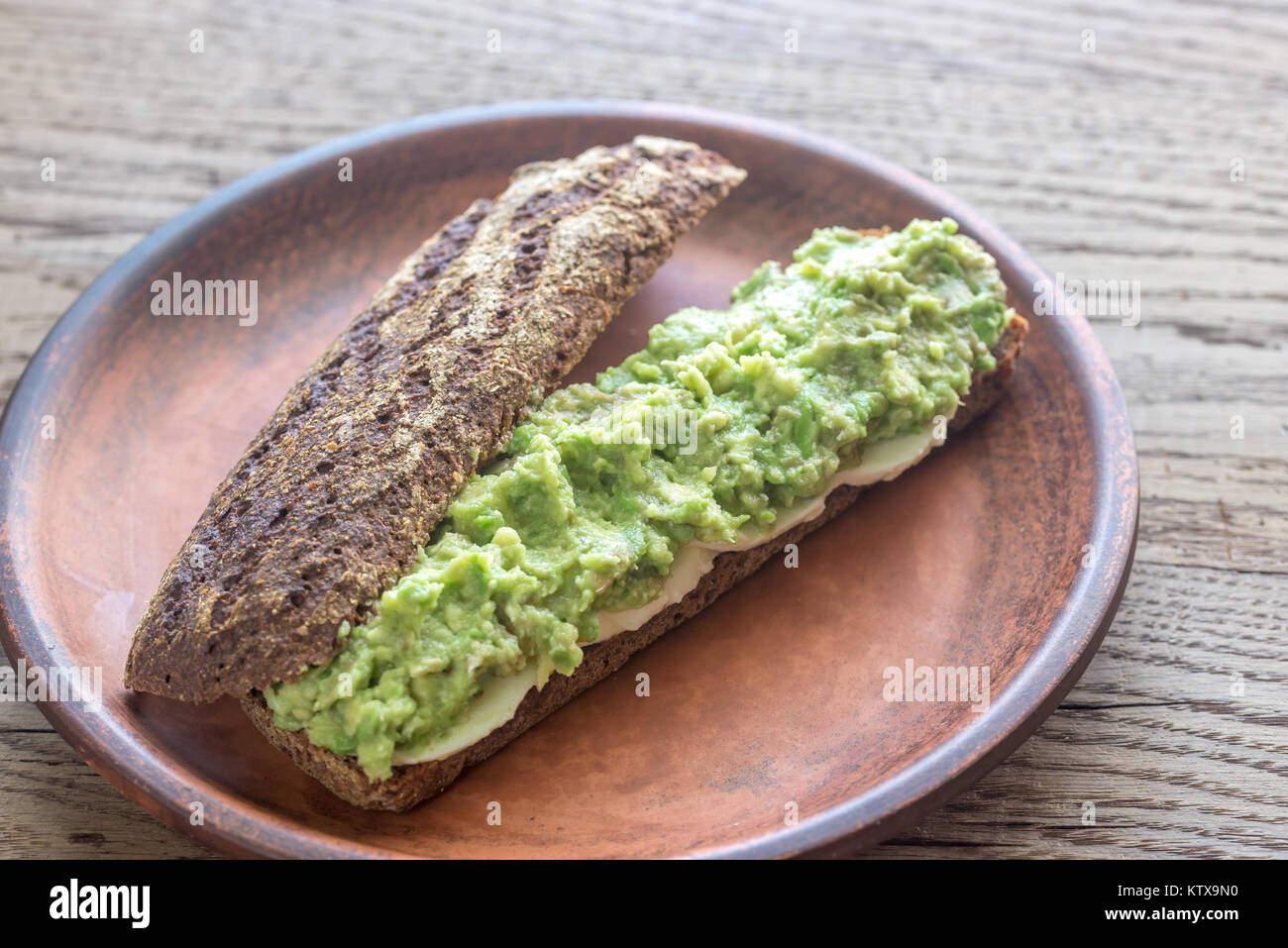 Sandwich with smashed avocado Stock Photo - Alamy