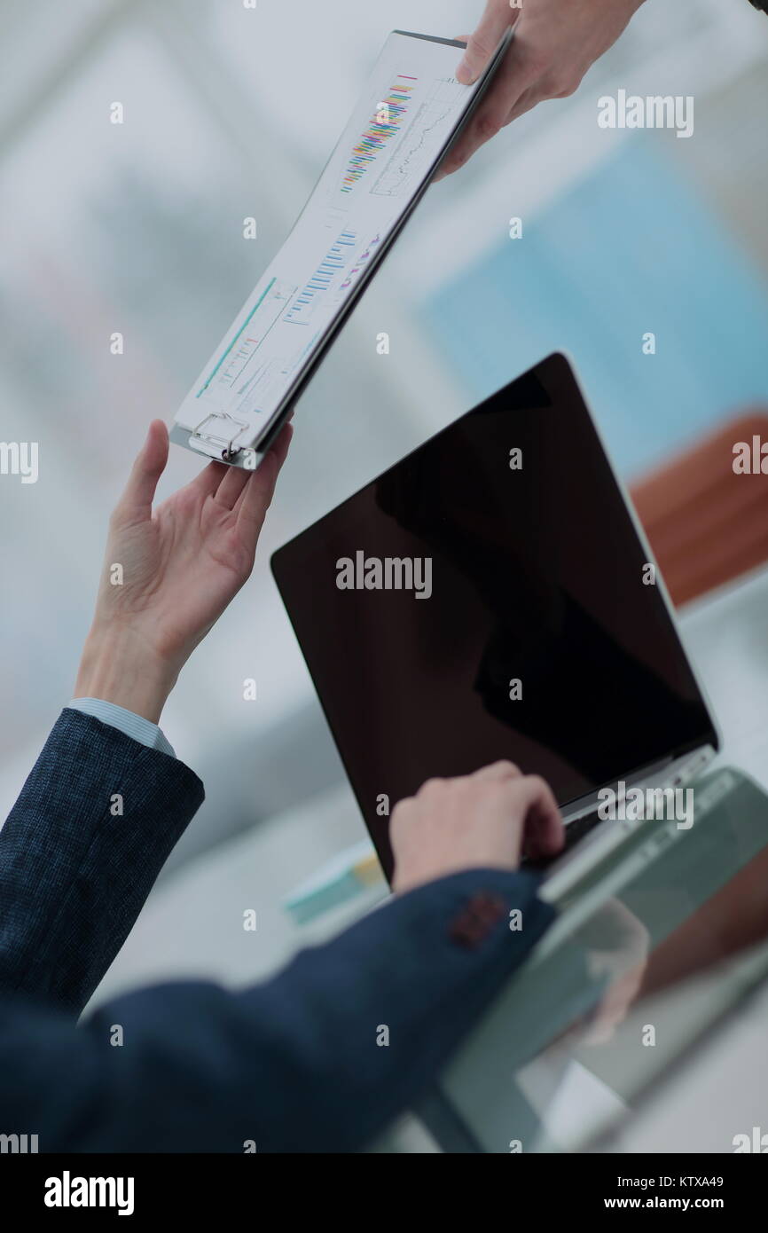 Businessman his colleague giving contract to read and sign Stock Photo ...