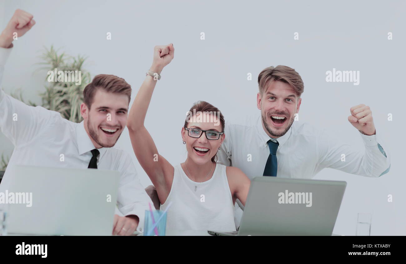 Picture of happy business team celebrating victory in office Stock ...