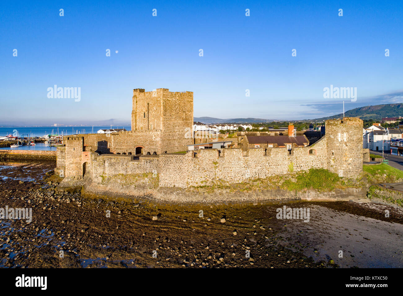 Medieval Norman Castle in Carrickfergus near Belfast in sunrise light ...