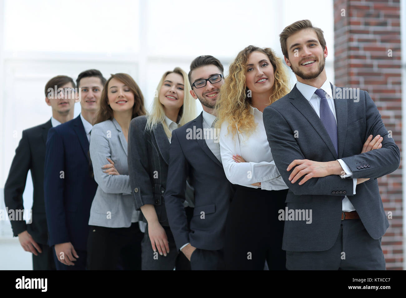 successful business team standing in a row Stock Photo - Alamy