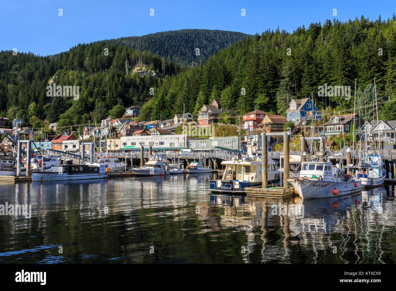 Commercial fishing boats, town and forest, beautiful sunny summer day ...