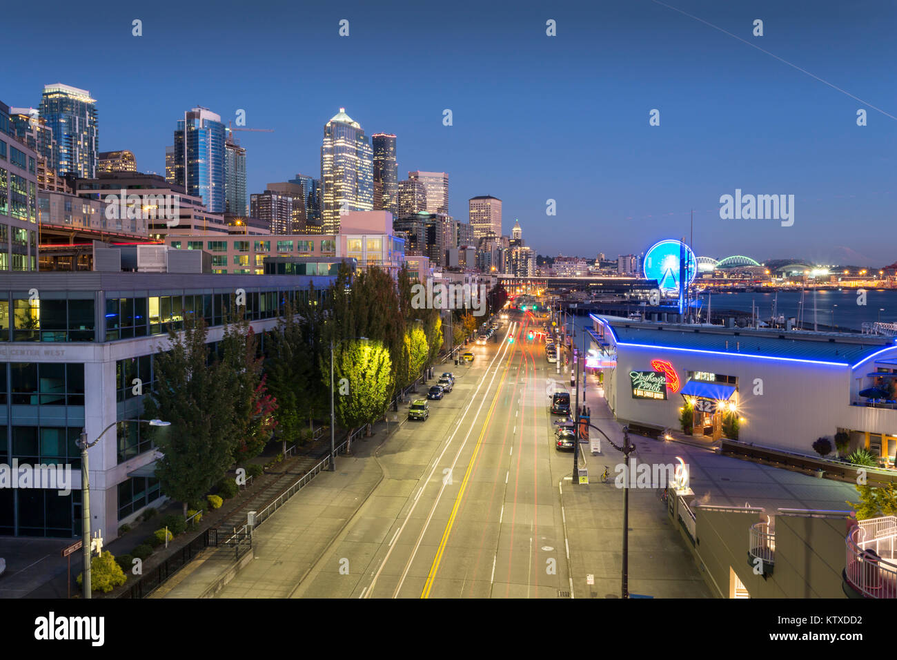 Elevated view of Seattle skyline and traffic on Alaskan Way at dusk ...