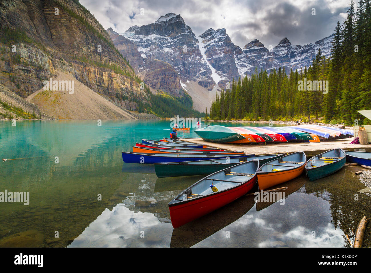 Tranquil setting of rowing boats on Moraine Lake, Banff National Park ...