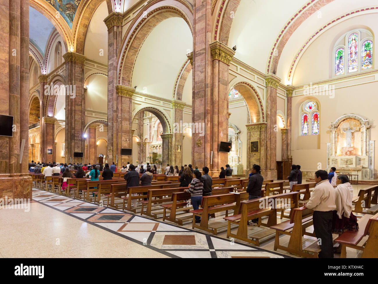 Cuenca Ecuador - people worshipping in the interior of Cuenca Cathedral ...