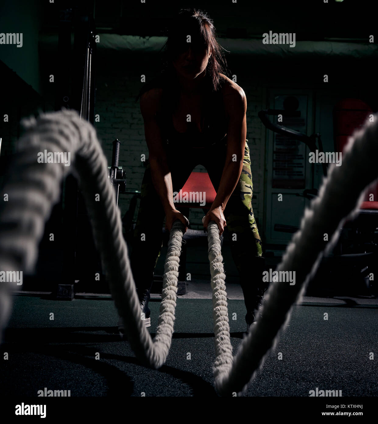 girl at the gym with ropes Stock Photo - Alamy