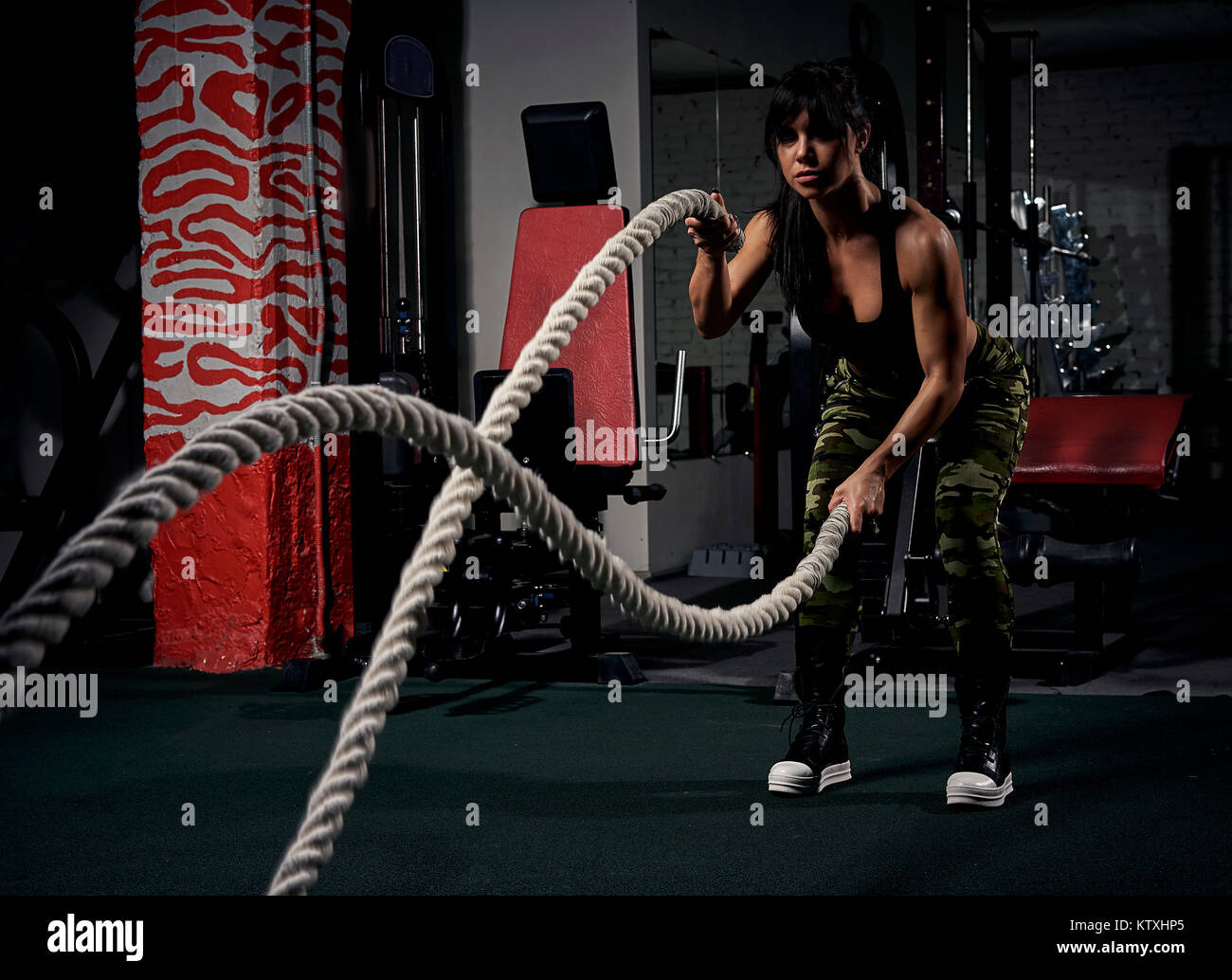 girl at the gym with ropes Stock Photo - Alamy