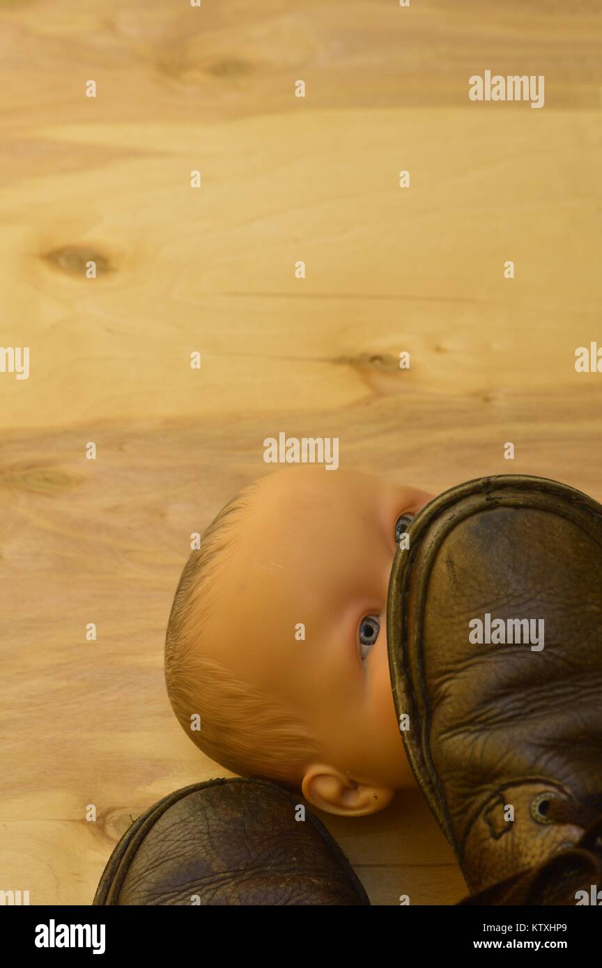 shoes stepping on a toy doll Stock Photo - Alamy