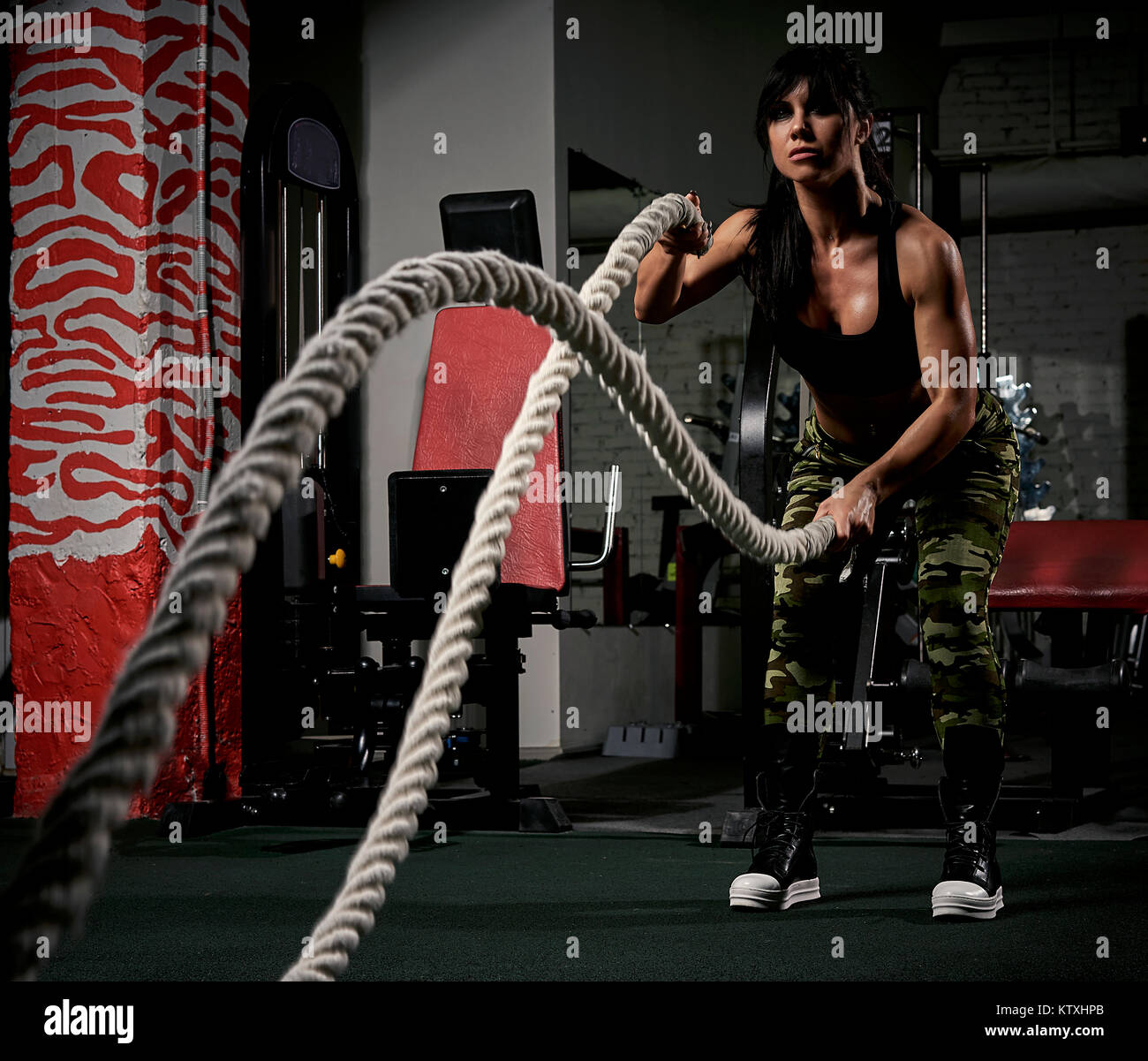 girl at the gym with ropes Stock Photo - Alamy