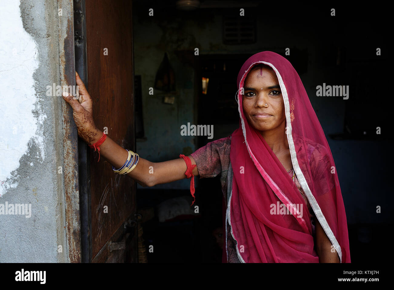 Portrait of young indian woman wearing sari and a veil over her hair in ...