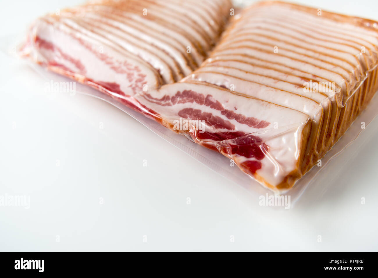 Raw Bacon Vacuum Sealed in Plastic Stock Photo - Alamy