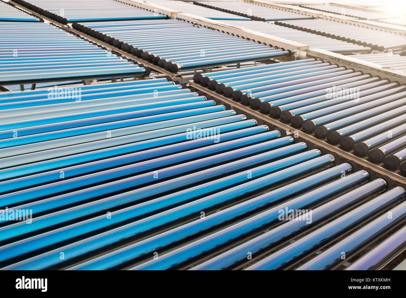 Vacuum tube collectors of solar water heating system Stock Photo - Alamy