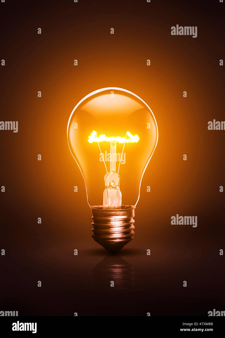 Warm colored and active bulb on a dark background Stock Photo - Alamy