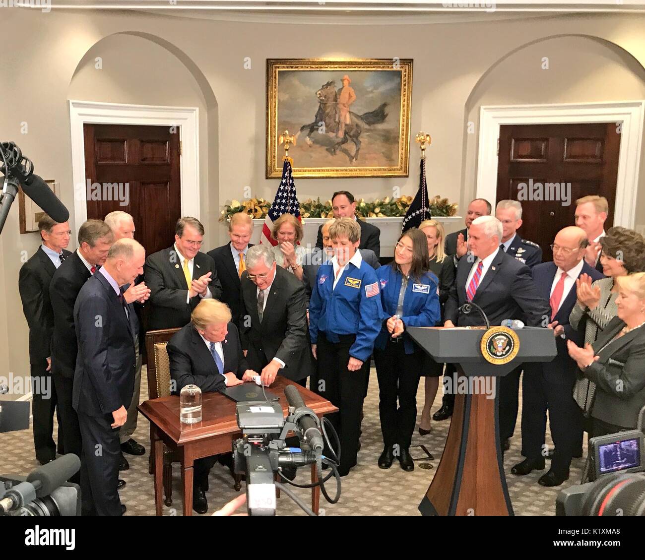 U.S. President Donald Trump signs the NASA Space Policy Directive 1 at ...