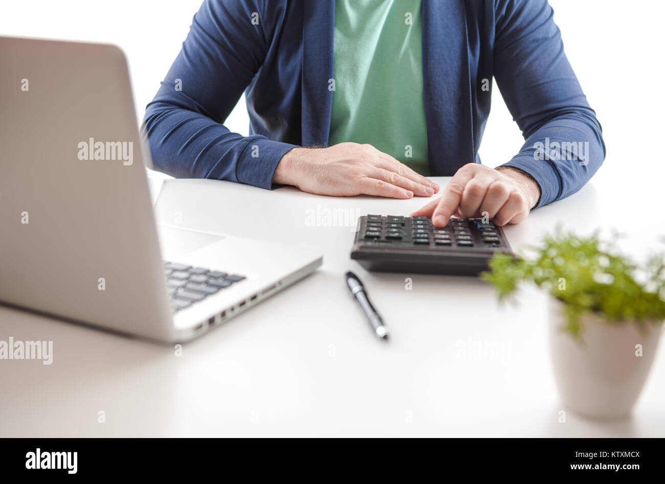 Closeup of a man checking accounts. Stock market chart and finger ...