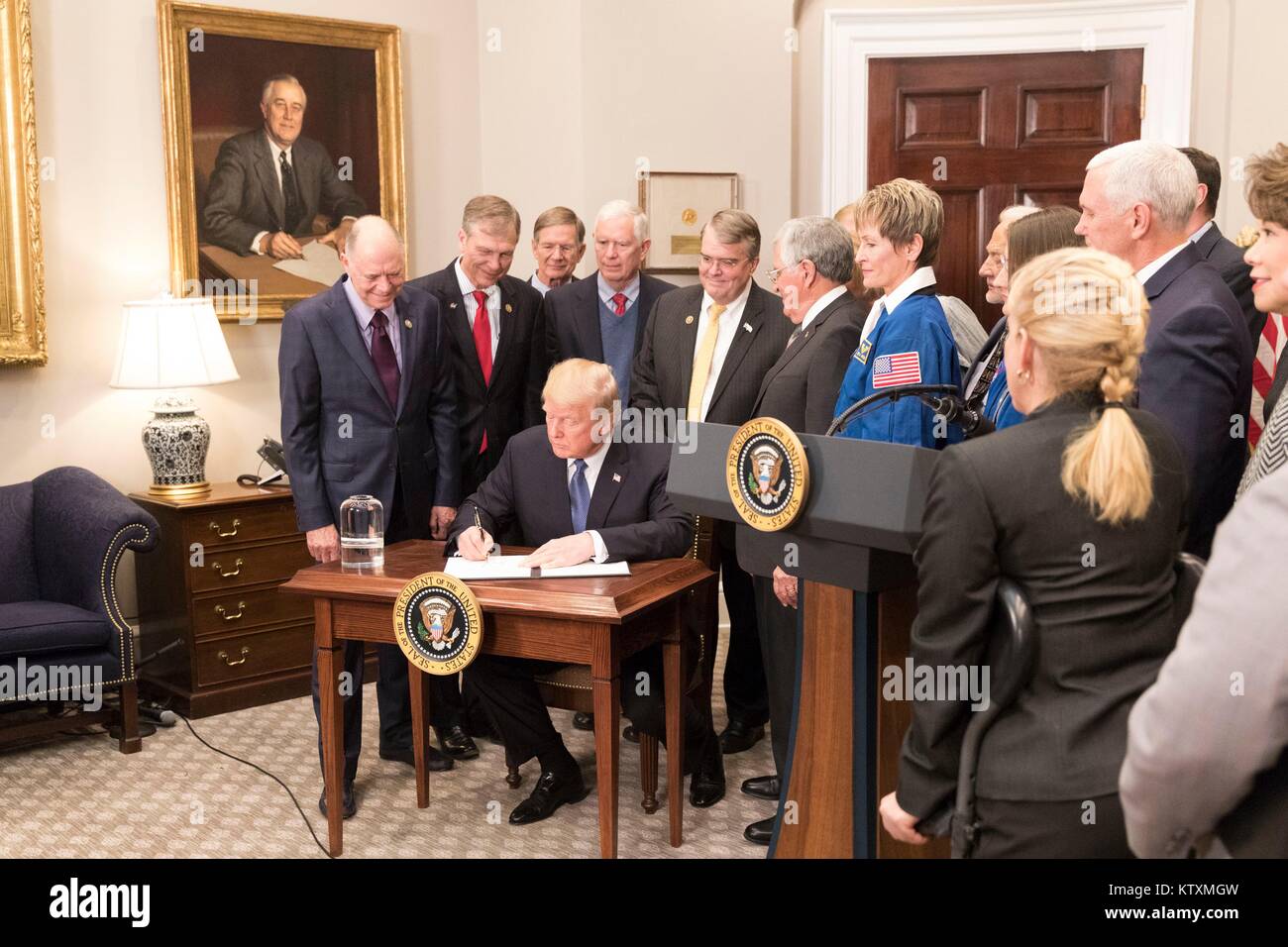 U.S. President Donald Trump signs the NASA Space Policy Directive 1 at ...