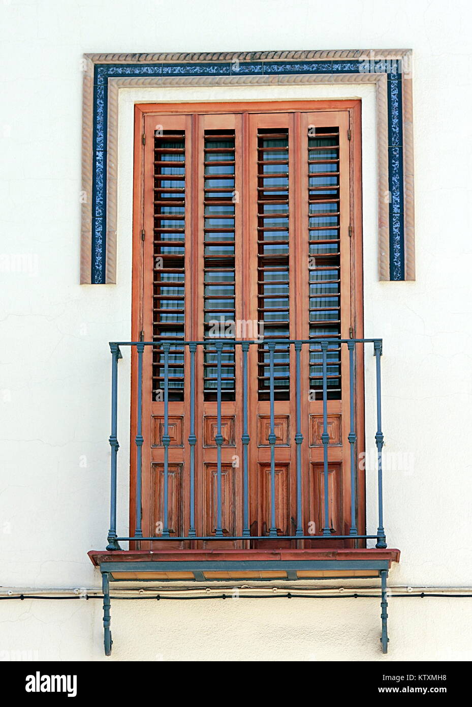 Beautiful window with shutters and small balcony in the town of Dos ...