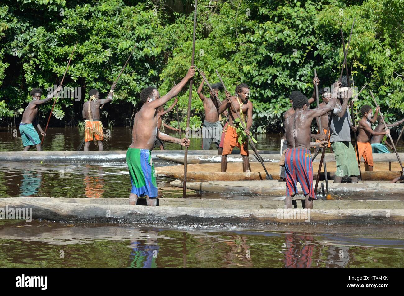 Canoe war ceremony of Asmat people. Headhunters of a tribe of Asmat ...