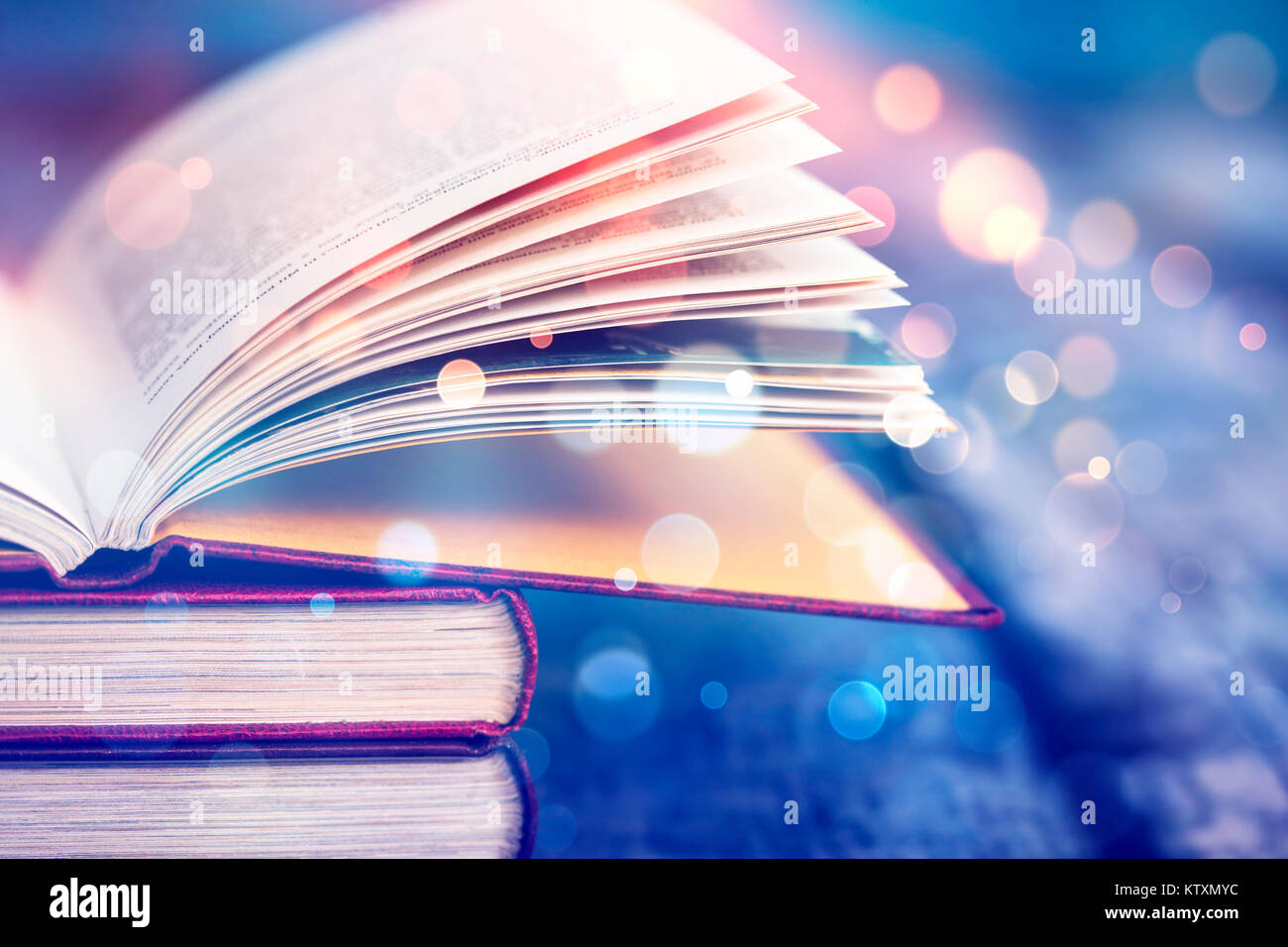 Open book with magic lights. Concept of wisdom, religion, reading ...