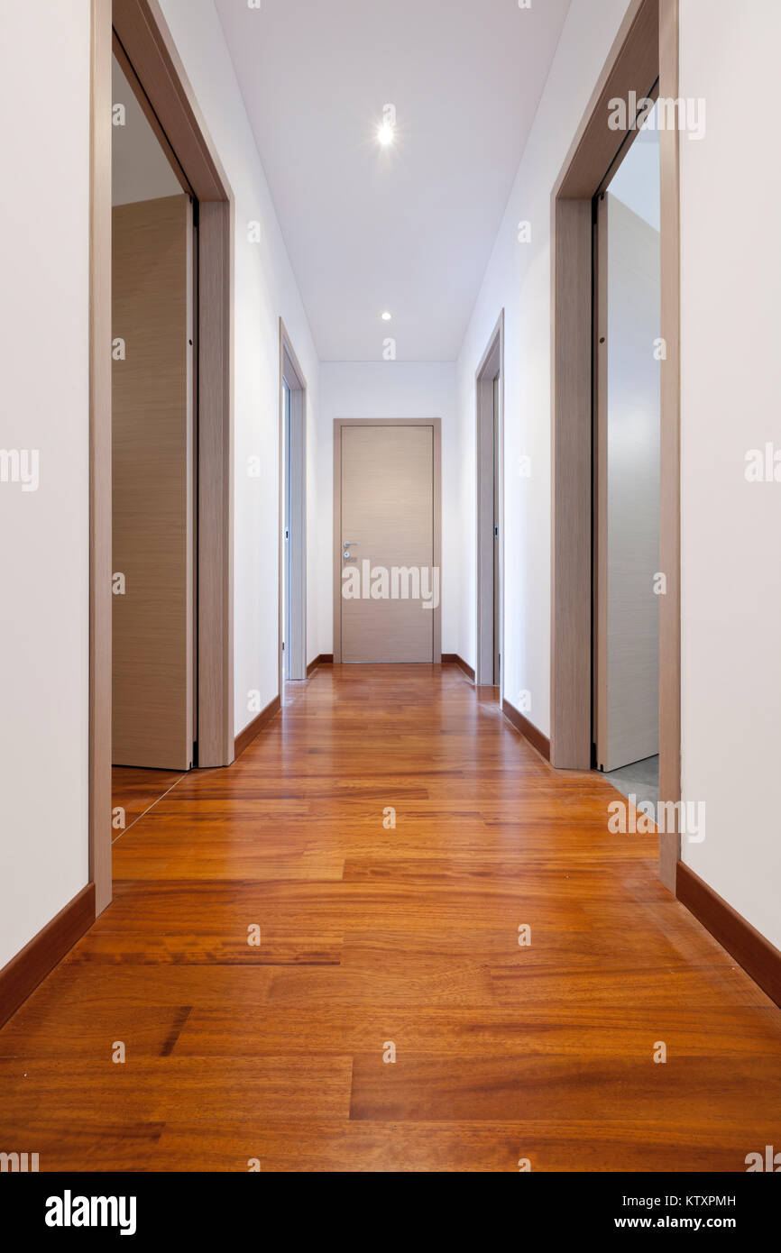 Interior of a modern house, an apartment, the corridor is long and ...
