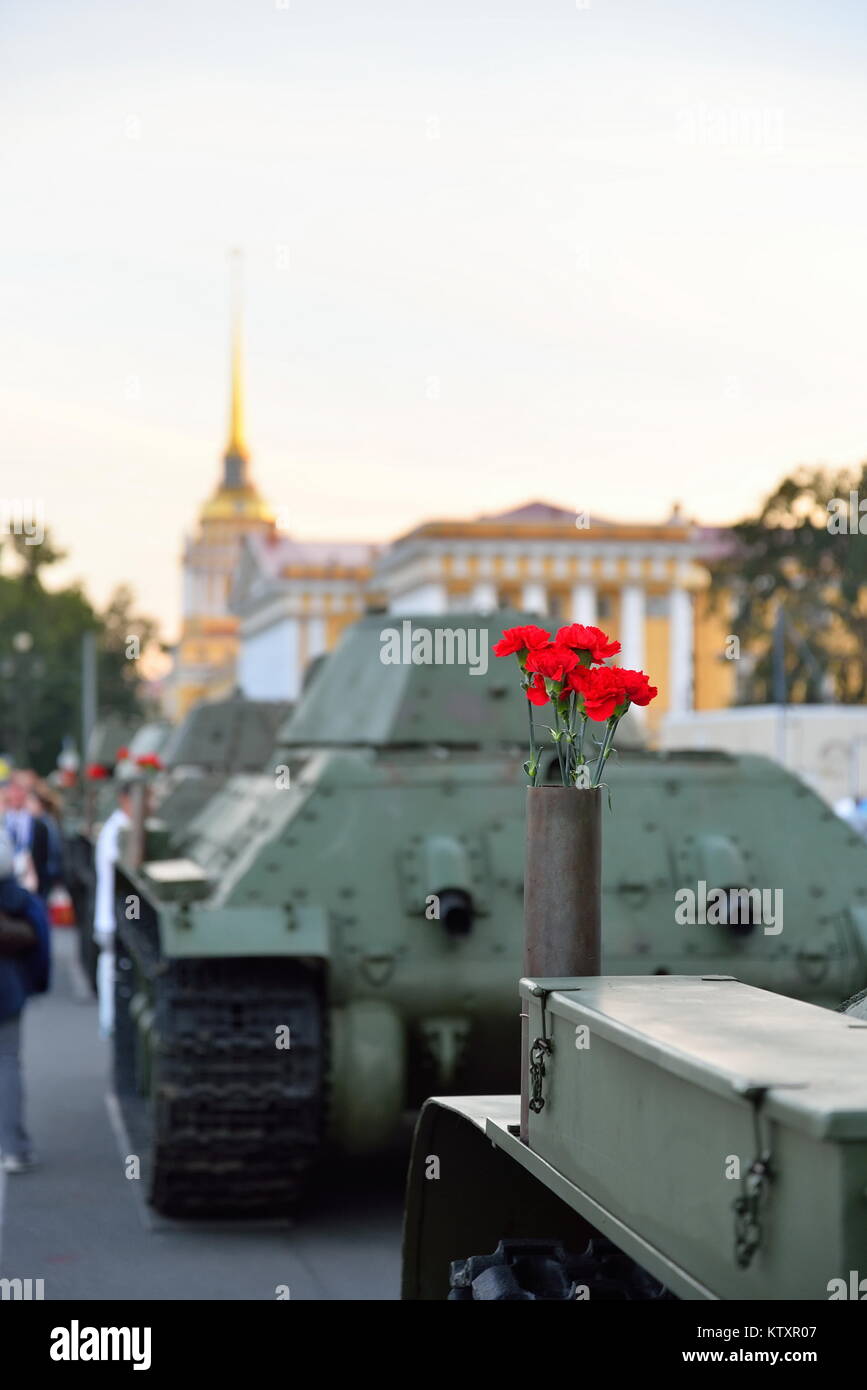 Red flowers in a gun cartridge on a medium Soviet tank T-34 on t Stock ...