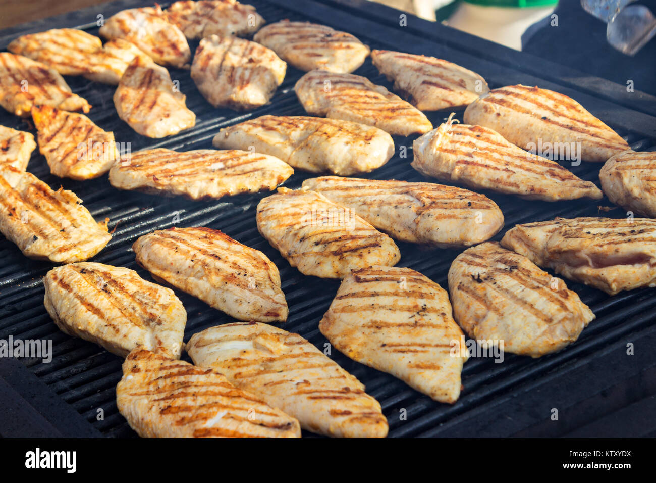 grilled chicken fillets on the barbecue. Street food Stock Photo - Alamy