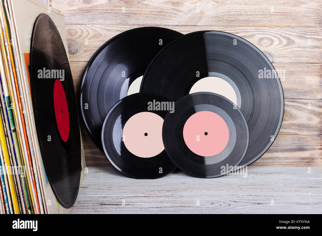 Vinyl record in front of a collection of albums. Copy space for text ...