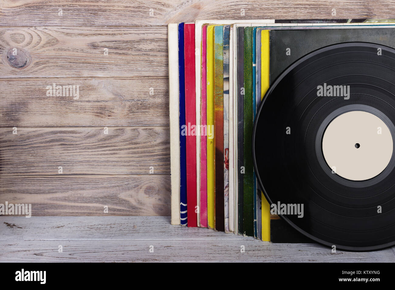 Retro styled image of a collection of old vinyl record lp's with ...