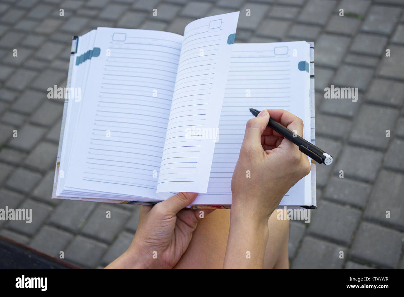 Girls hand writing in diary hi-res stock photography and images - Alamy