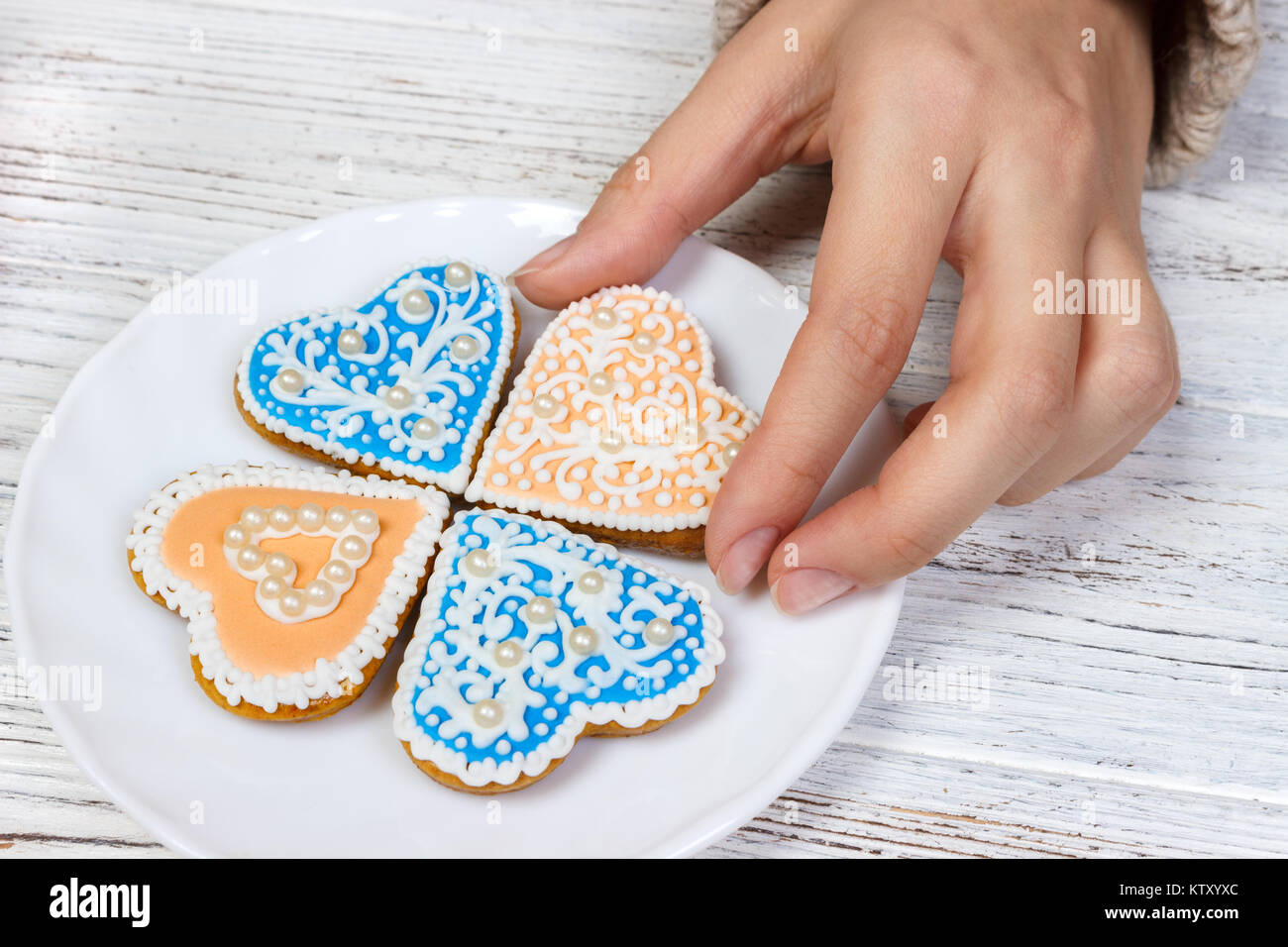Hands hold cookies in form of heart Stock Photo - Alamy