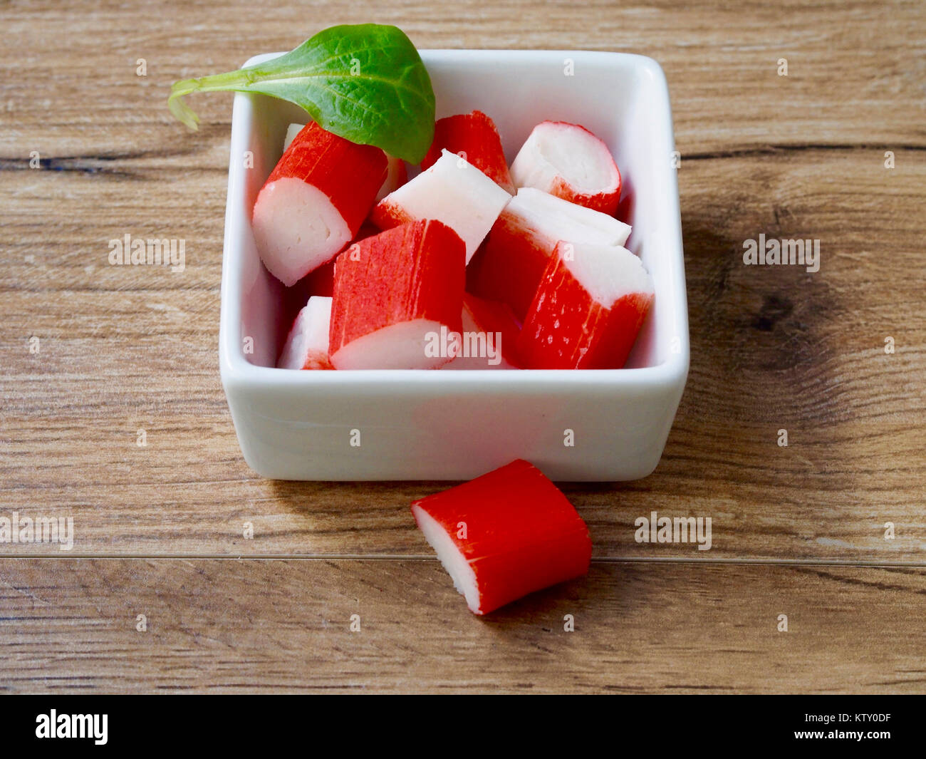 Surimi in a recipe on wood background Stock Photo - Alamy