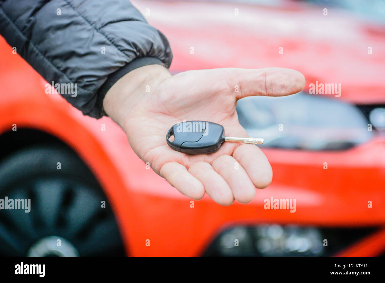 Men holding car key - buying and selling automobiles Stock Photo - Alamy